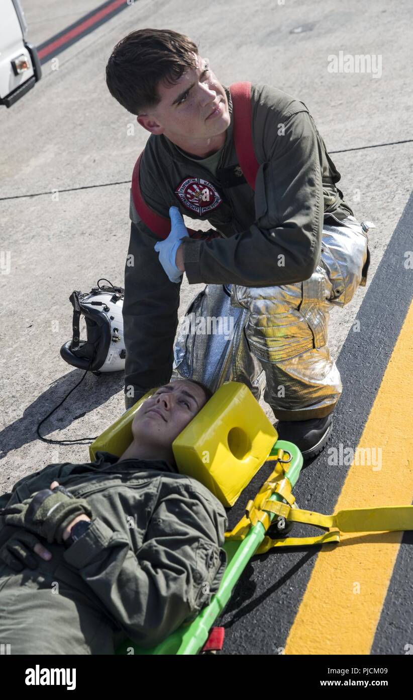 Capt. Megan Love, from Marine Light Attack Helicopter 469, acts as a ...