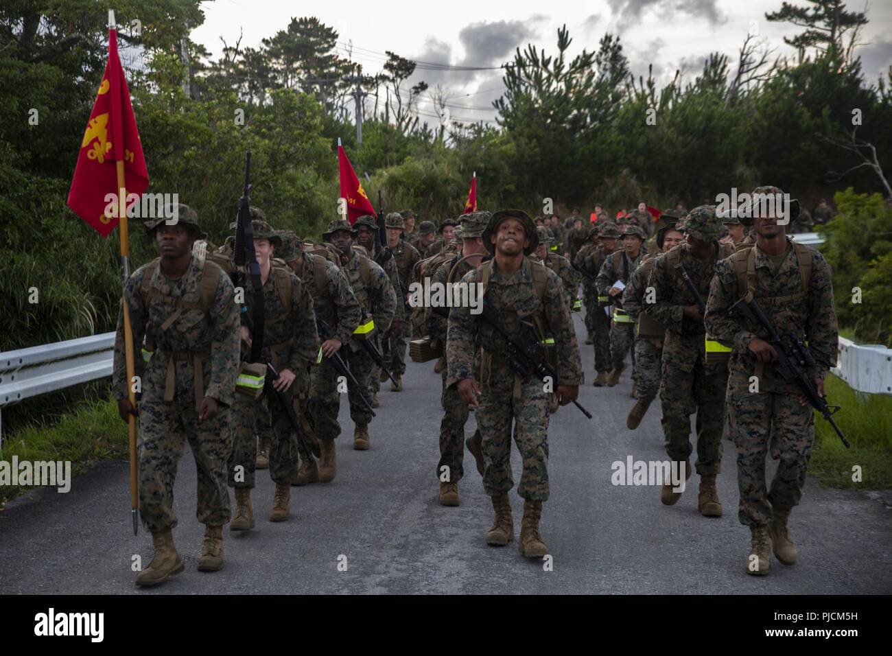 Marines with Combat Logistics Battalion 31 march in formation during a ...