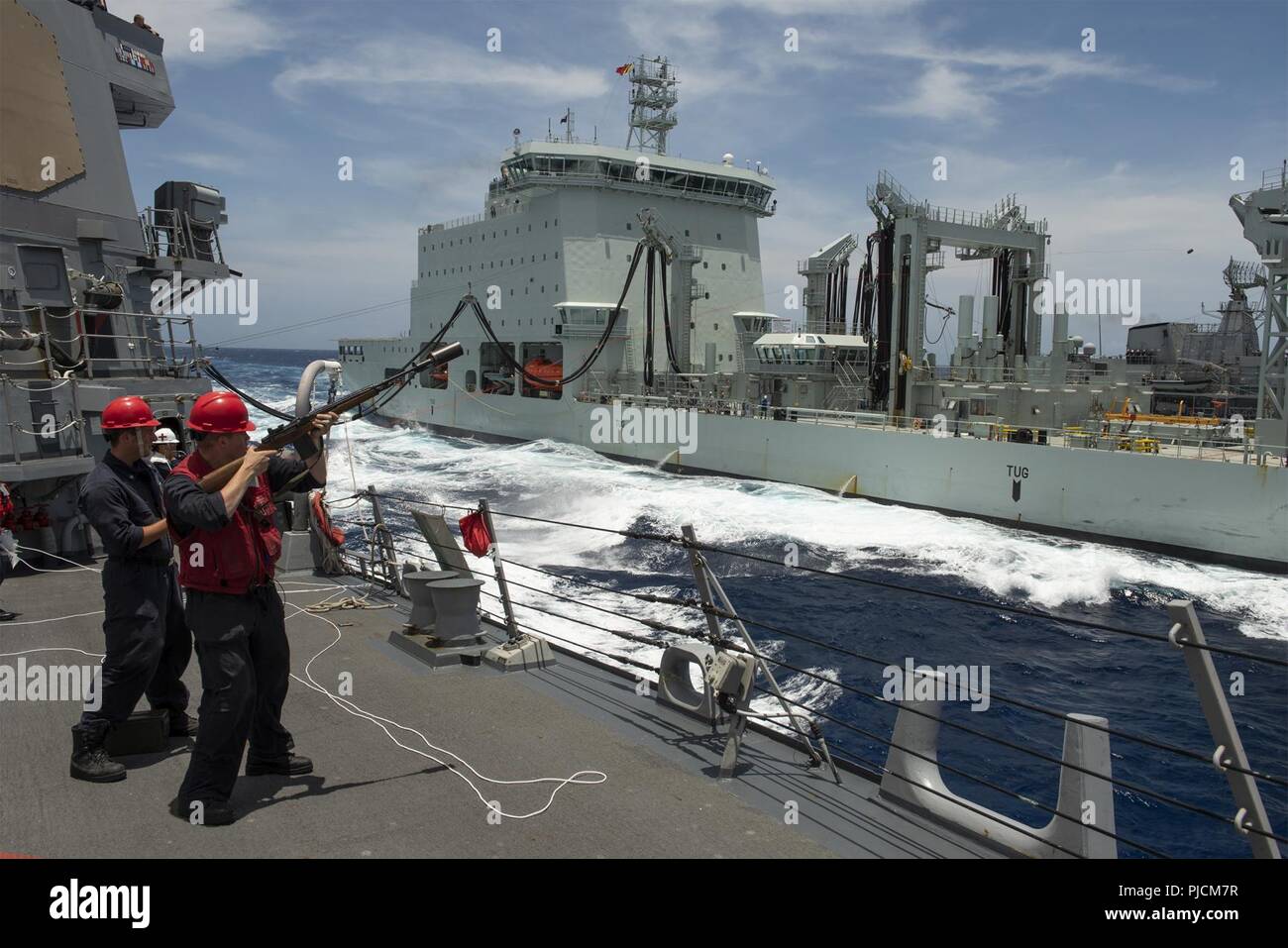 PACIFIC OCEAN (July 24, 2018) Gunner's Mate 3rd Class Benjamin Reeb ...