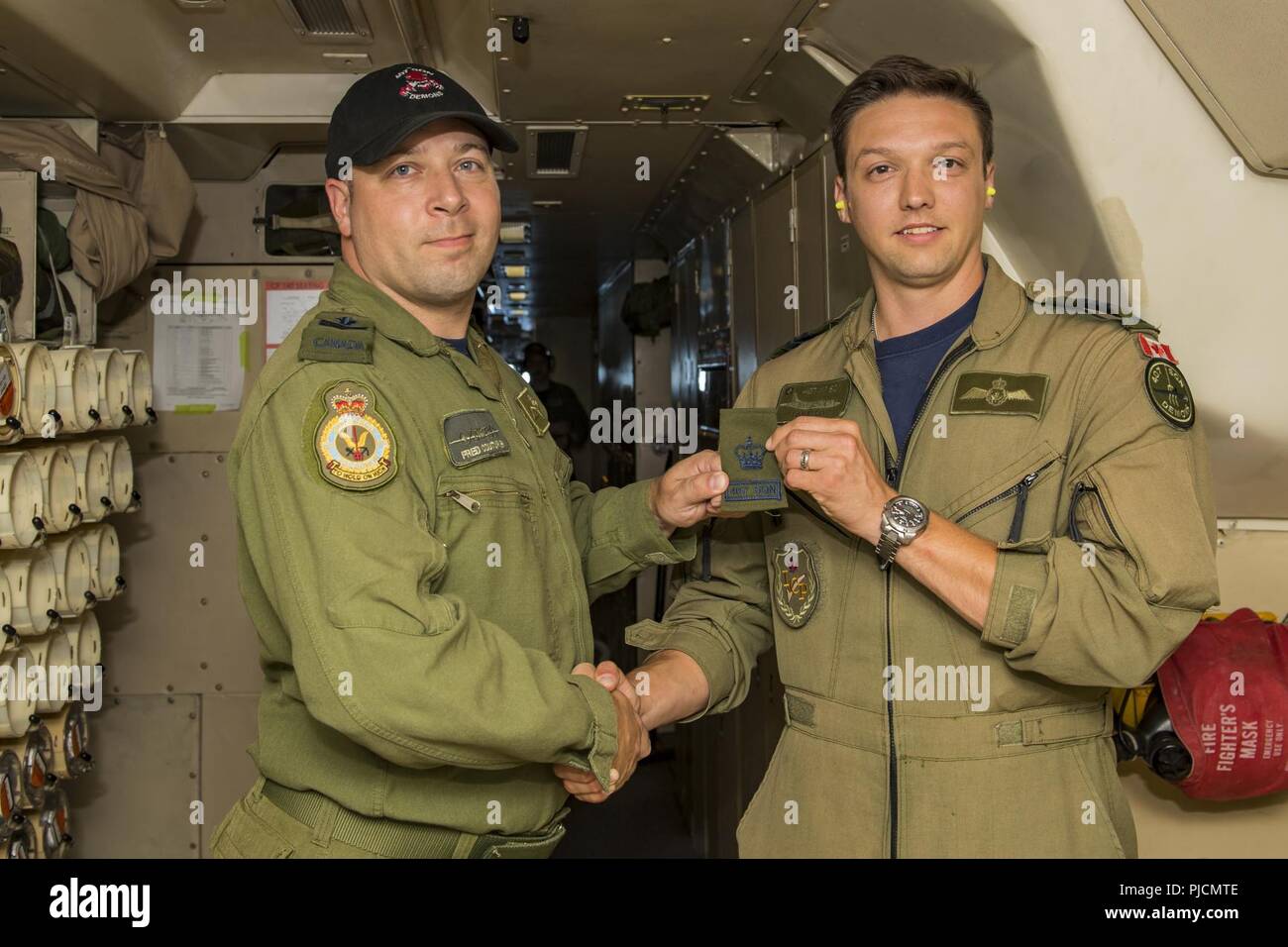 PACIFIC OCEAN (July 24, 2018) Major Dan Klco (right), a pilot with a ...