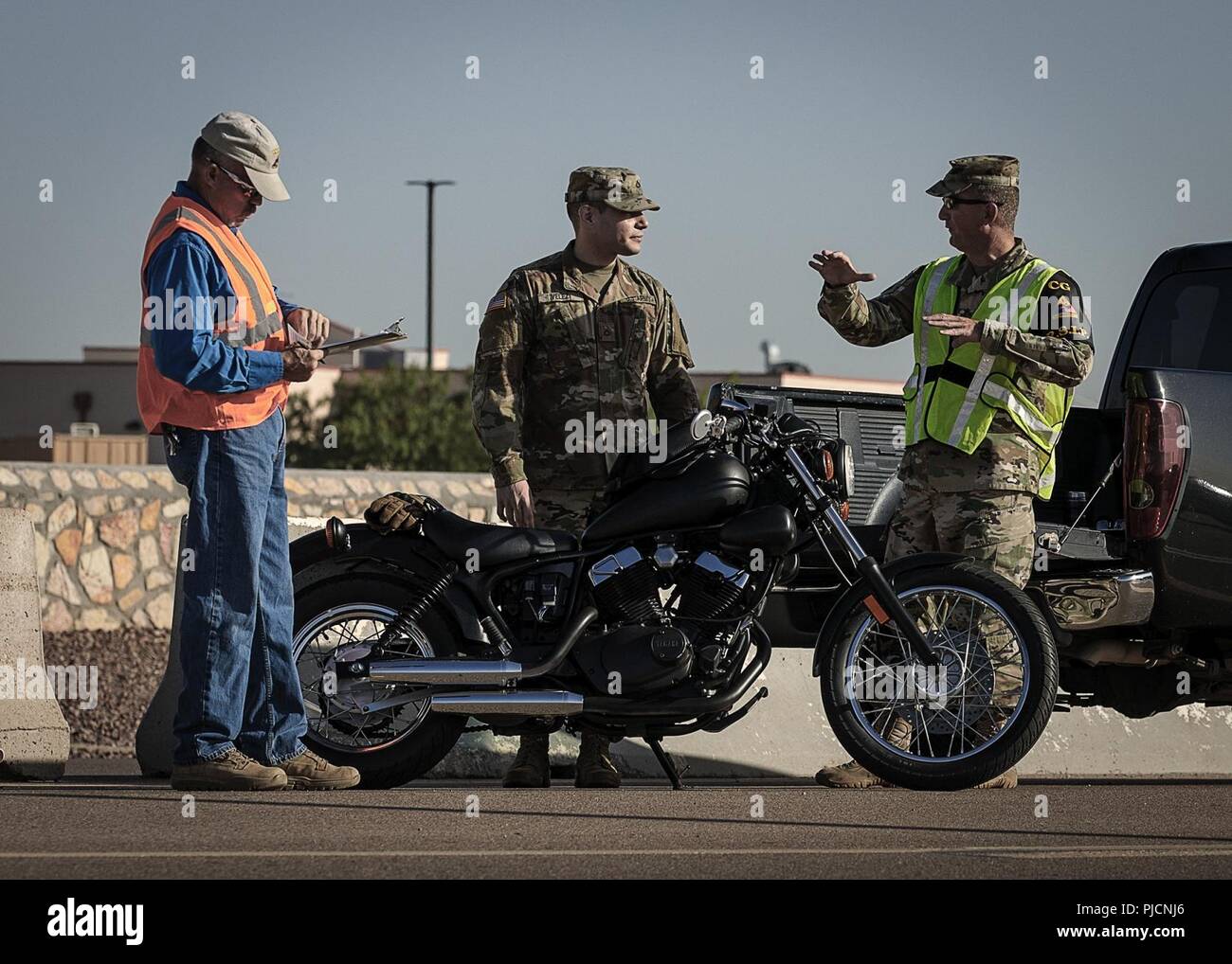 Chief Warrant Officer 4 Thomas Nagies, right, talks riding with a ...