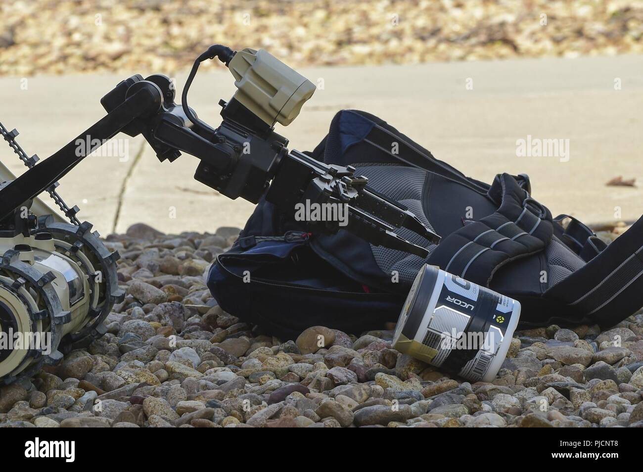 A micro tactical ground robot removes a “bomb” in the restricted area ...