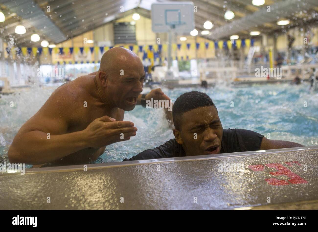 1st Sgt. Peter Sarni III offers encouragement to Spc. Ryan Clarke ...