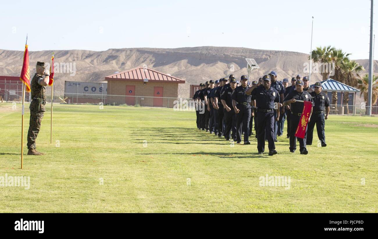 Police Chief Darwin O'Neal leads a police officers and fire personnel ...