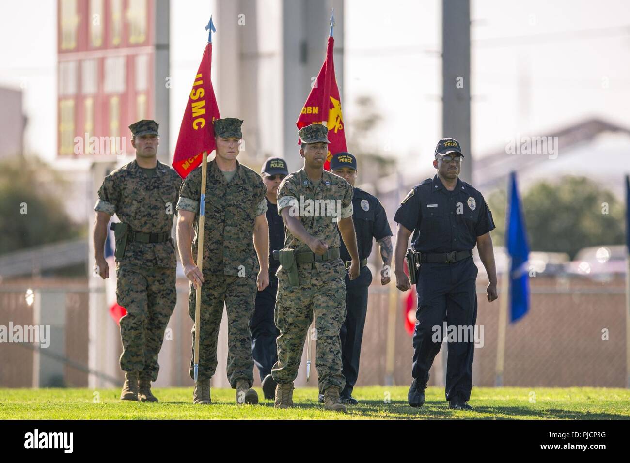 Captain Adam Rahman, Headquarters Company commander, marches down the ...