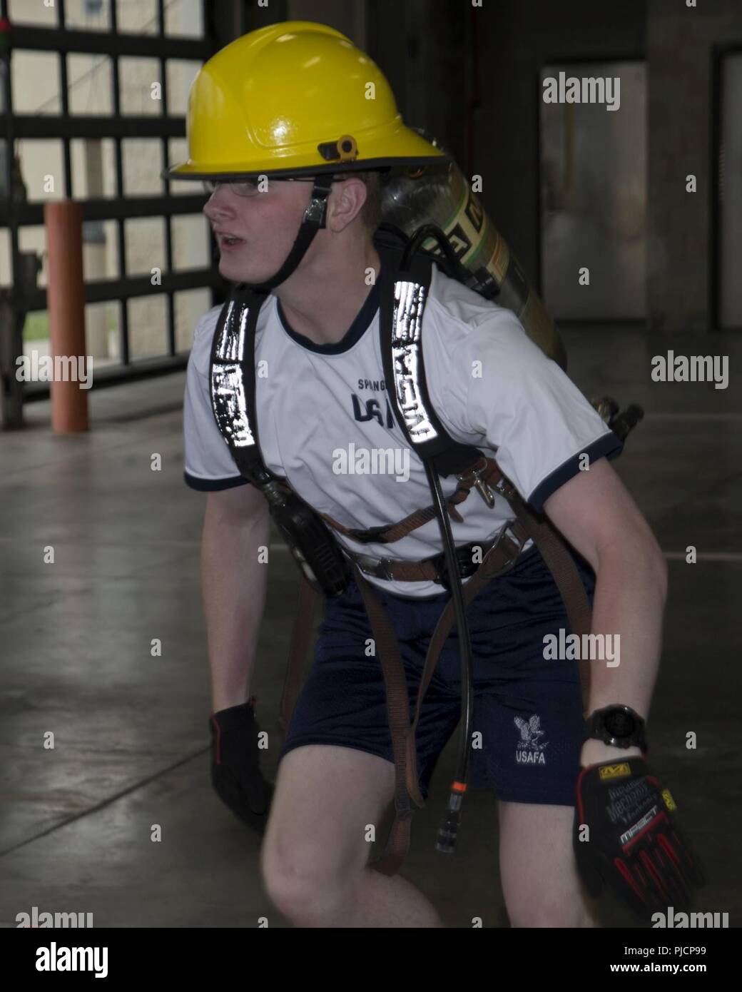 A U.S. Air Force Academy cadet runs through an obstacle course at the ...