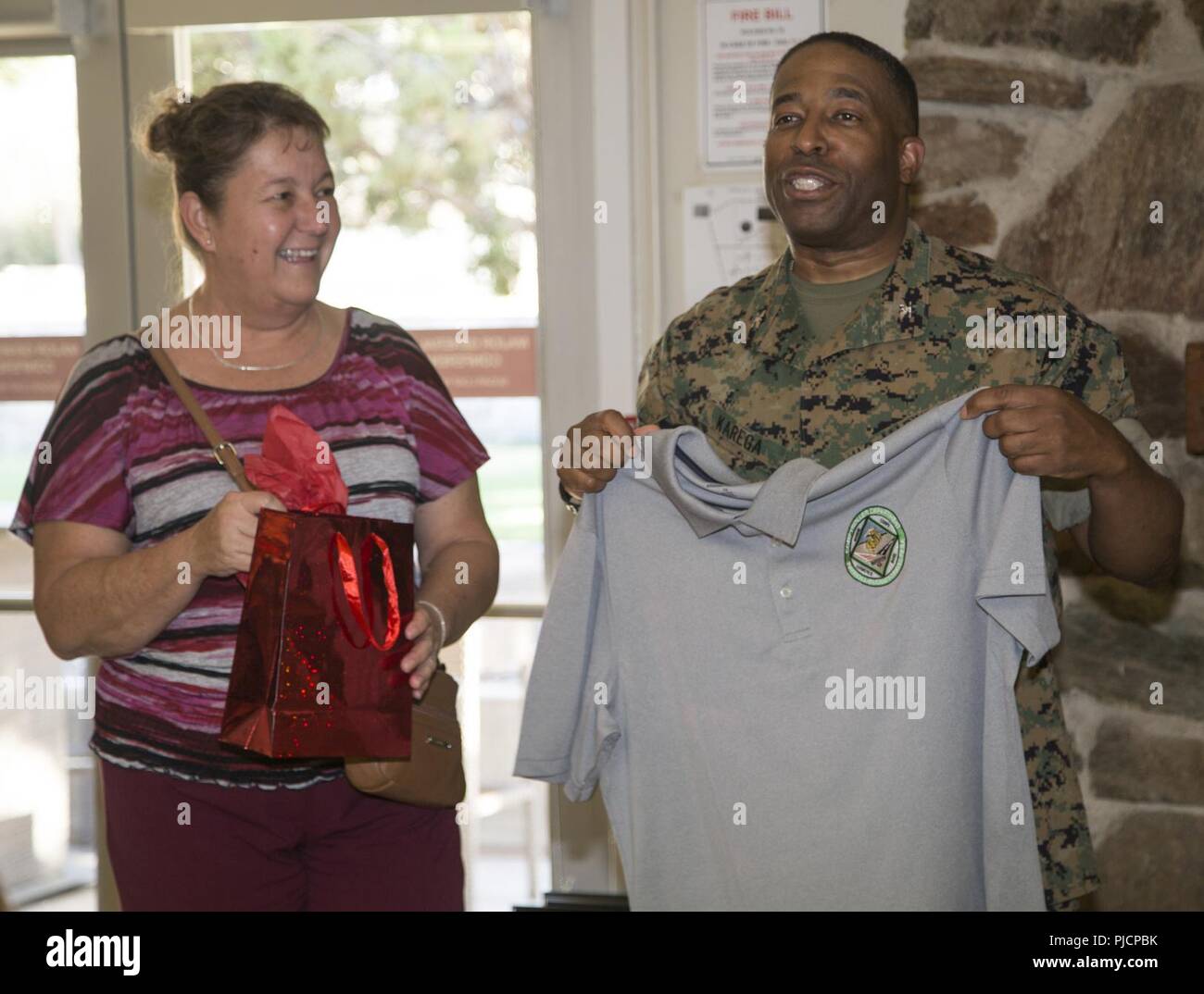 Colonel Sekou S. Karega, outgoing commanding officer, is all smiles ...