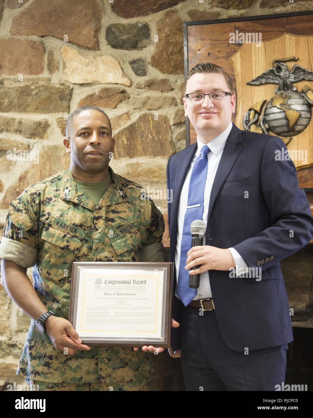 Colonel Sekou Karega, outgoing commanding officer, poses with Dakota ...