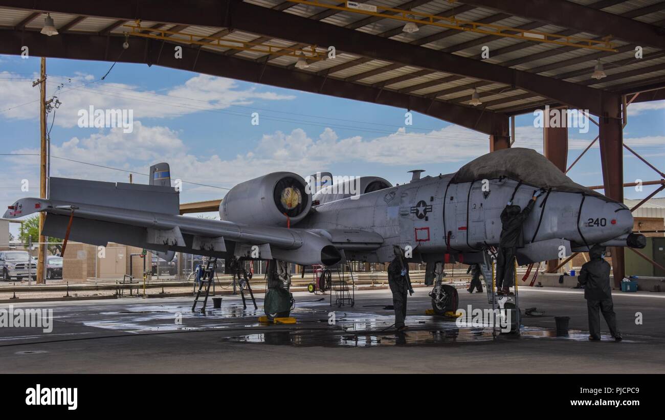 U.S. Airmen clean an A-10 Thunderbolt II in an aircraft wash rack at ...