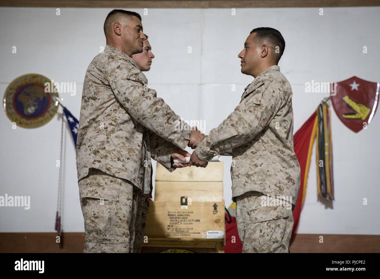 UNDISCLOSED LOCATION, MIDDLE EAST – A U.S. Marine receives his ...
