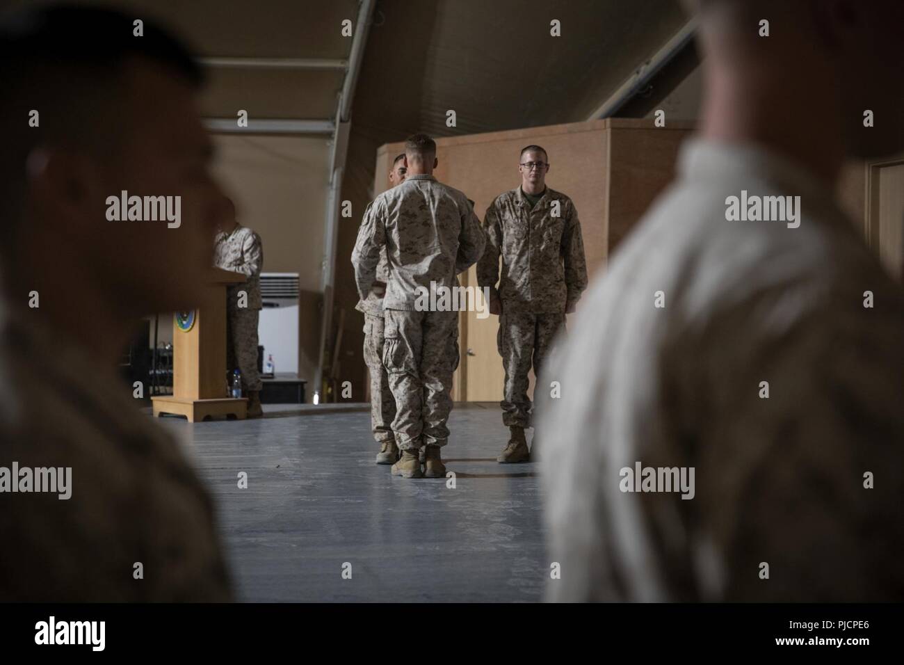 UNDISCLOSED LOCATION, MIDDLE EAST – A U.S. Marine receives his ...