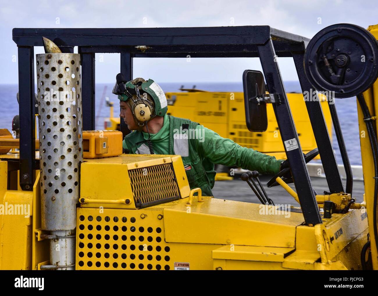 Us navy flight deck tractor hi-res stock photography and images - Alamy