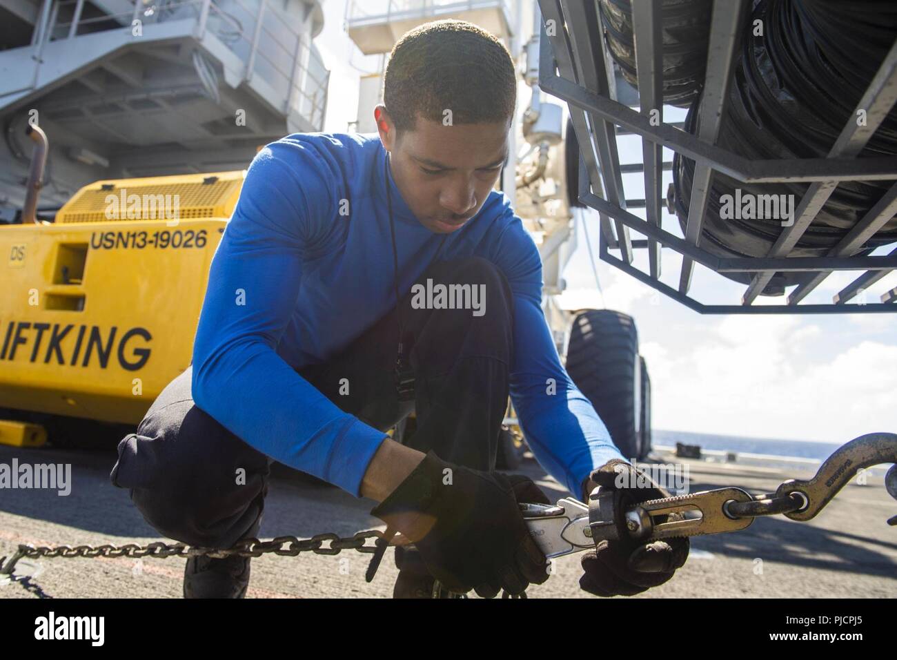 Us navy flight deck tractor hi-res stock photography and images - Alamy