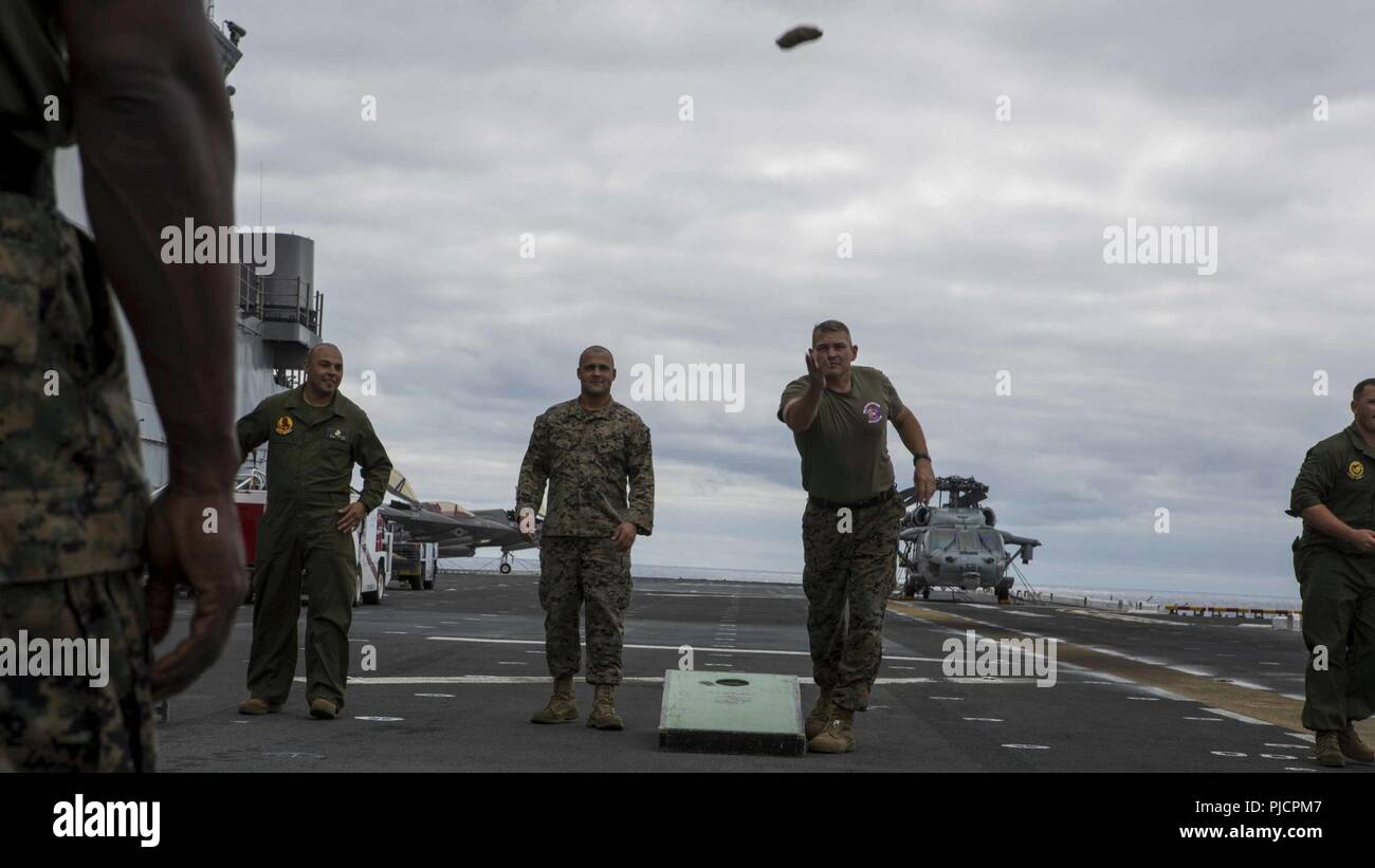 PACIFIC OCEAN - U.S. Marine Sgt. Maj. Chris Denham (right), sergeant major of Battalion Landing ...