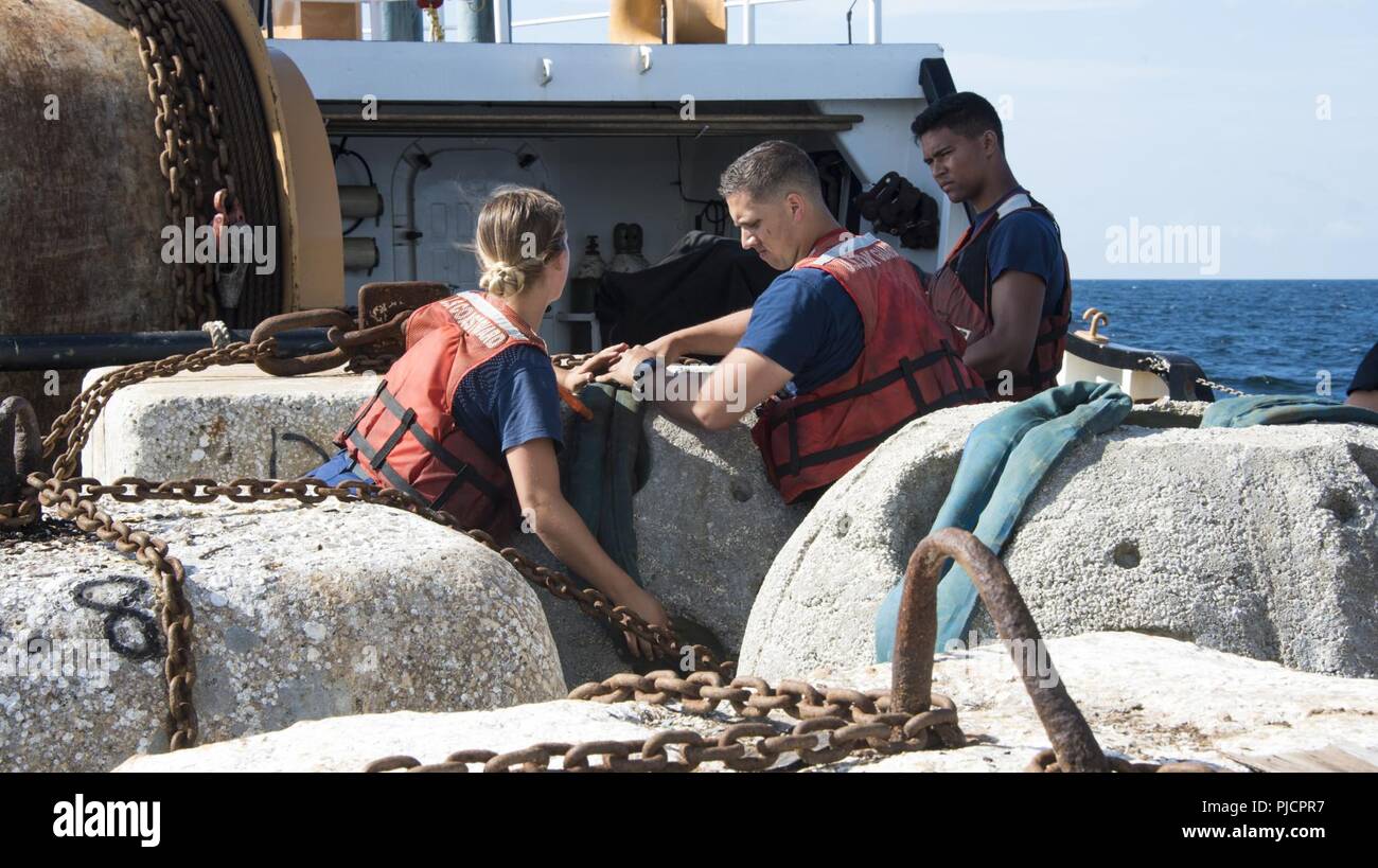 Coast Guard Cutter Maria Bray crew members prepare concrete reef balls ...