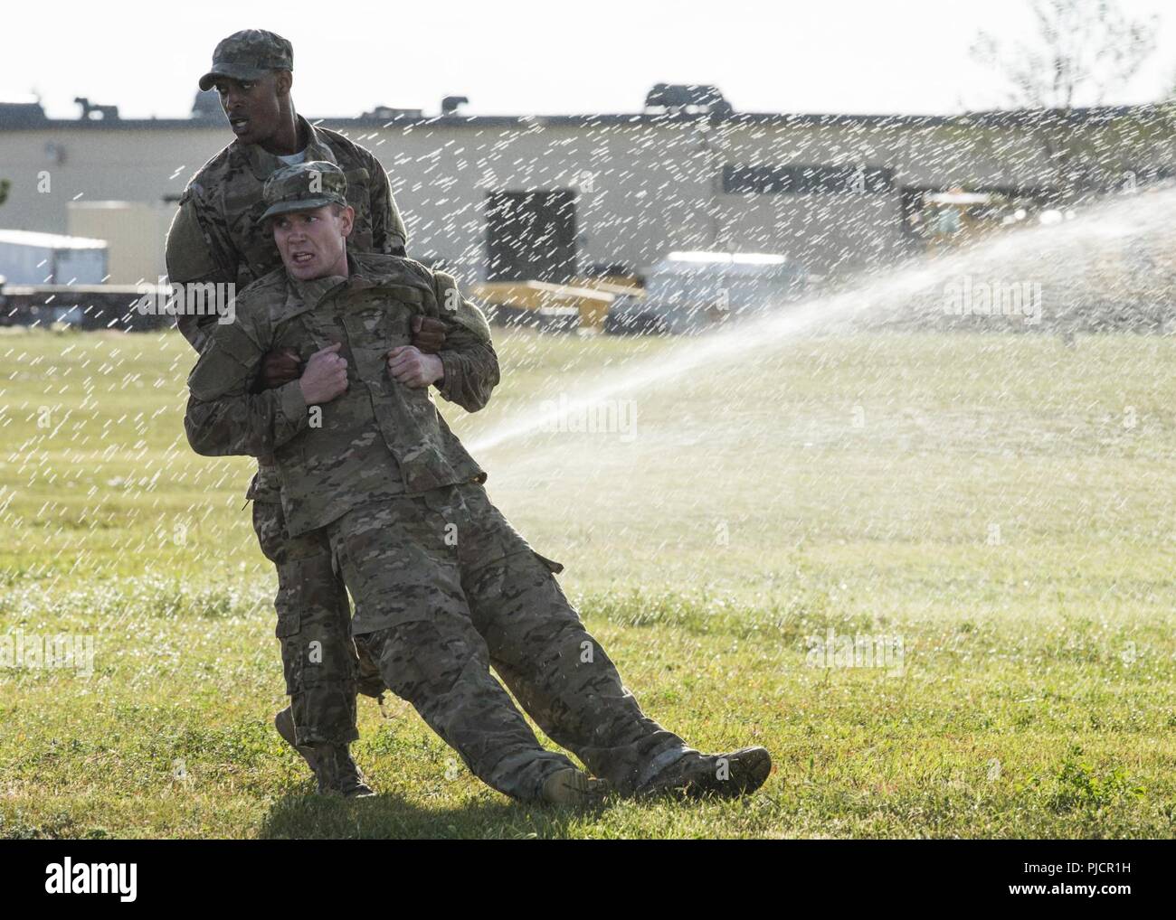 Airmen with the 91st Security Forces Group complete a buddy-drag during ...