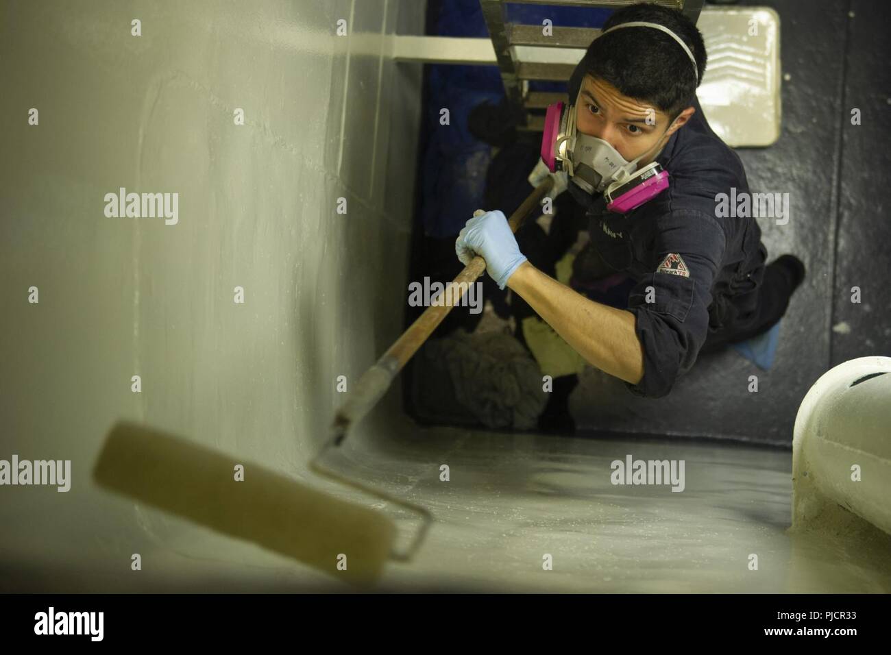 PACIFIC OCEAN (July 17, 2018) Engineman 3rd Class Edwin Cardenas paints ...