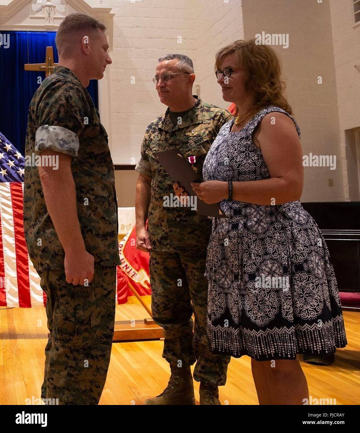 U.S. Navy Lt. Cmdr. Carl J Stamper’s wife Lee Ann Stamper receives a ...