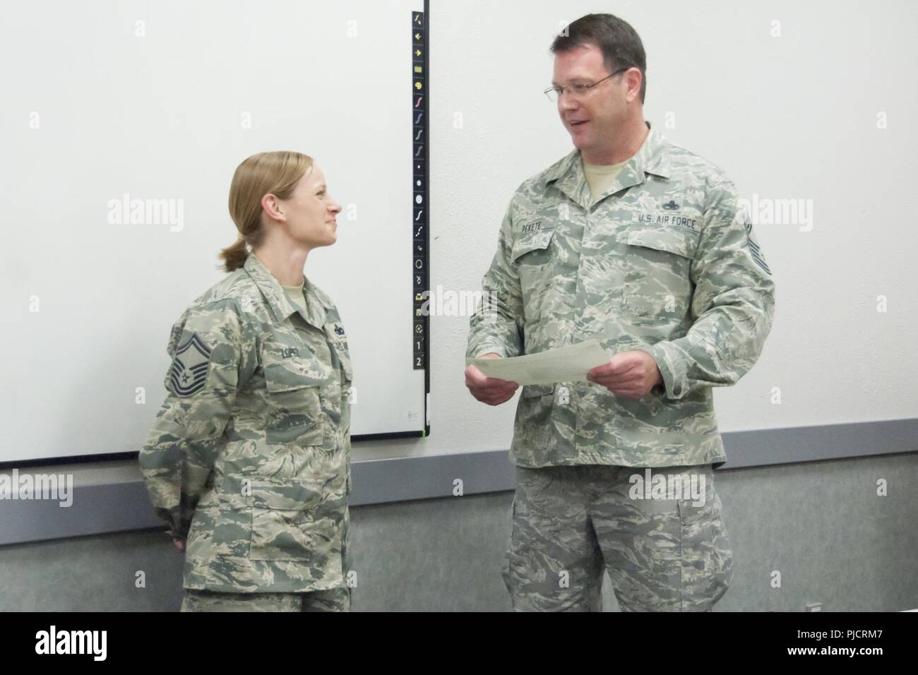 Senior Master Sgt. Tina Lopez, 302nd Security Forces Squadron, accepts ...