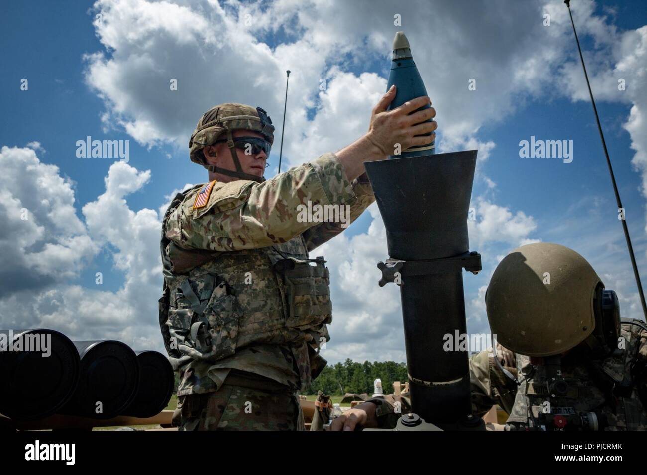 From left to right: Assistant Gunner Pfc.Terry Tompakou and Gunner Pfc ...