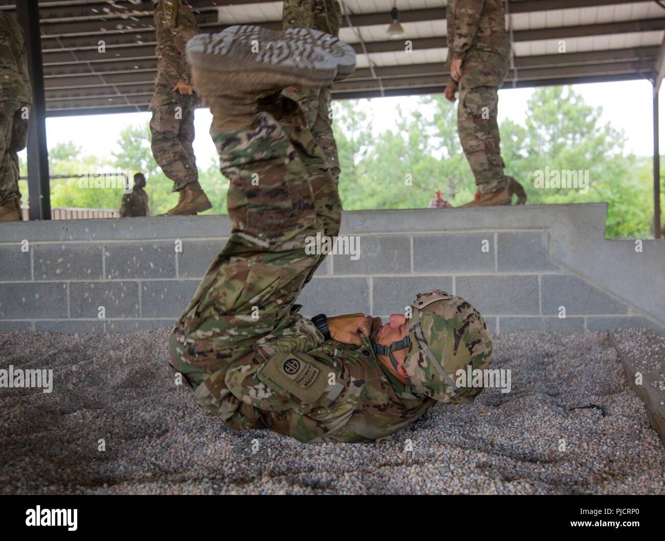 U.S. Army Paratrooper assigned to the 82nd Airbrone Division does a ...