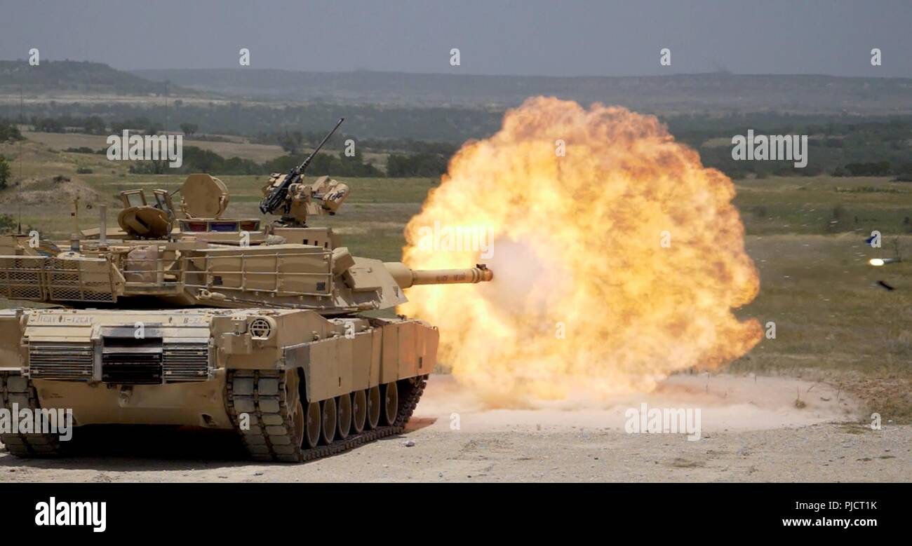 FORT HOOD, Tx--A Sabot round is fired from an M1A2 Abrams tank during ...