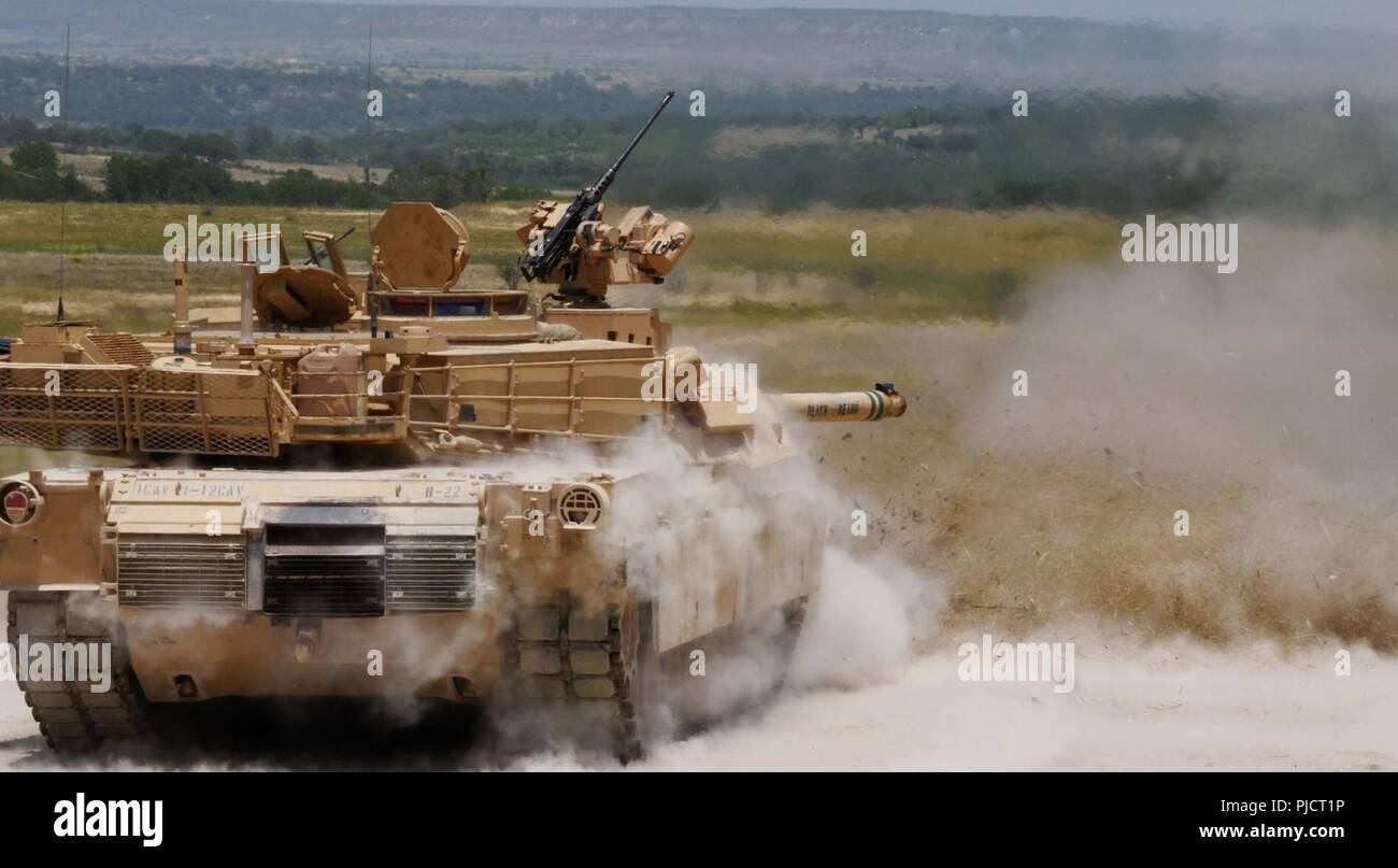 FORT HOOD, Tx--A 120mm round is fired from an M1A2 Abrams tank during ...