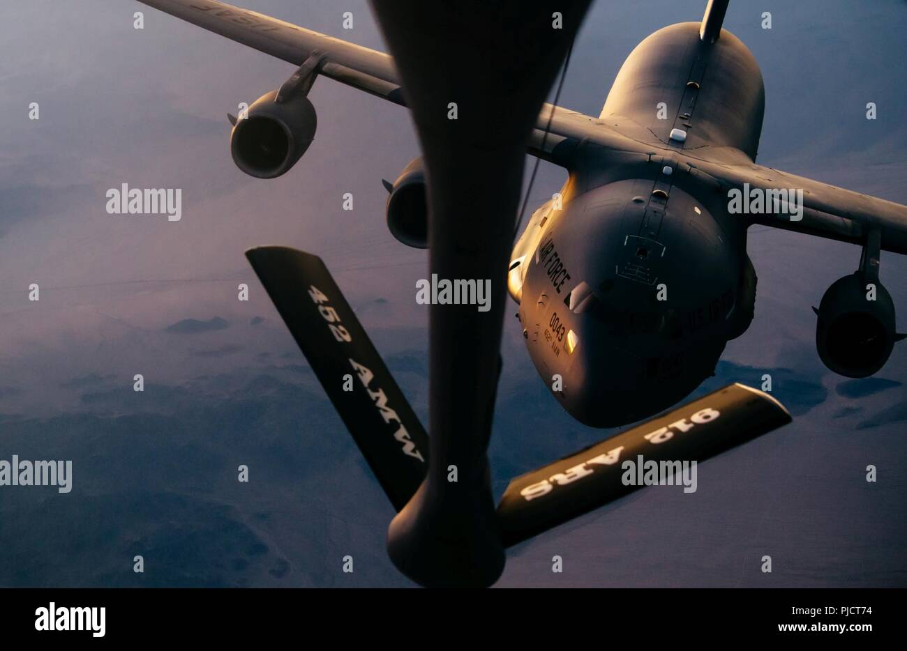 A 452nd Air Mobility Wing C-17 Globemaster III approaches to receive ...