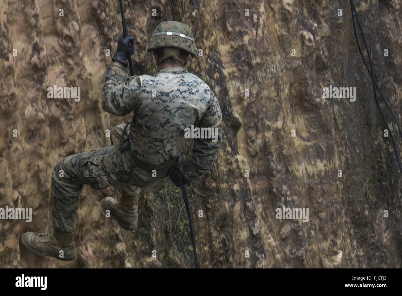 A Marine with Echo Company, Battalion Landing Team, 2nd Battalion, 5th ...