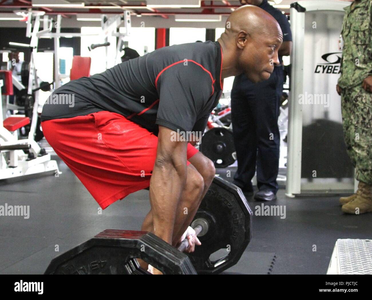 A handful of Marines participate in a weightlifting competition held at ...
