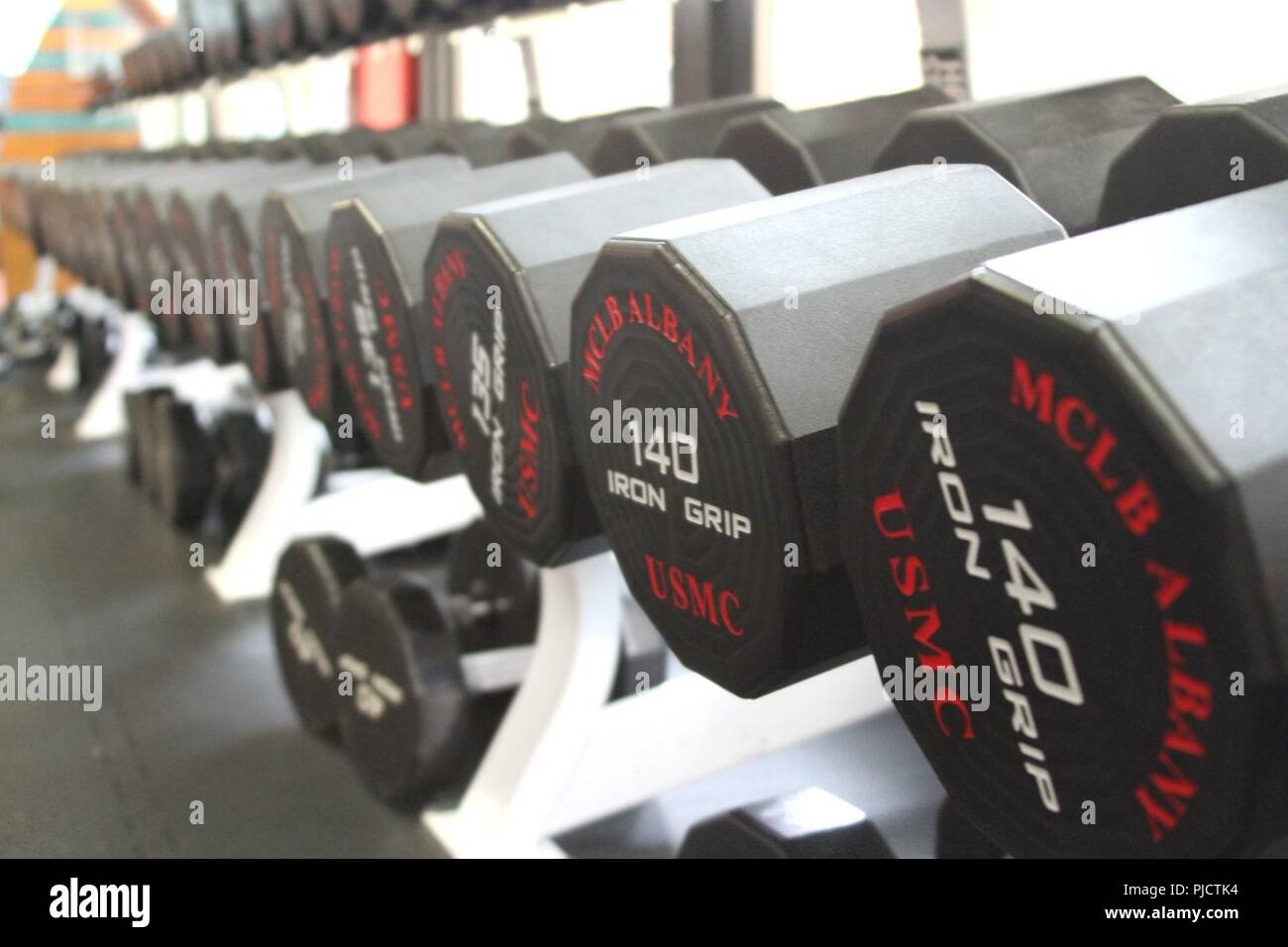 A handful of Marines participate in a weightlifting competition held at ...