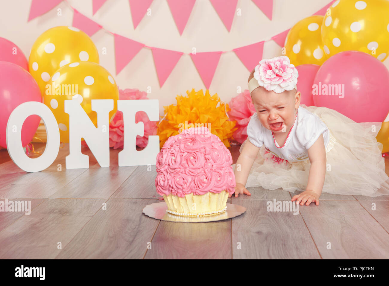 Portrait of crying upset Caucasian baby girl in tutu tulle skirt ...