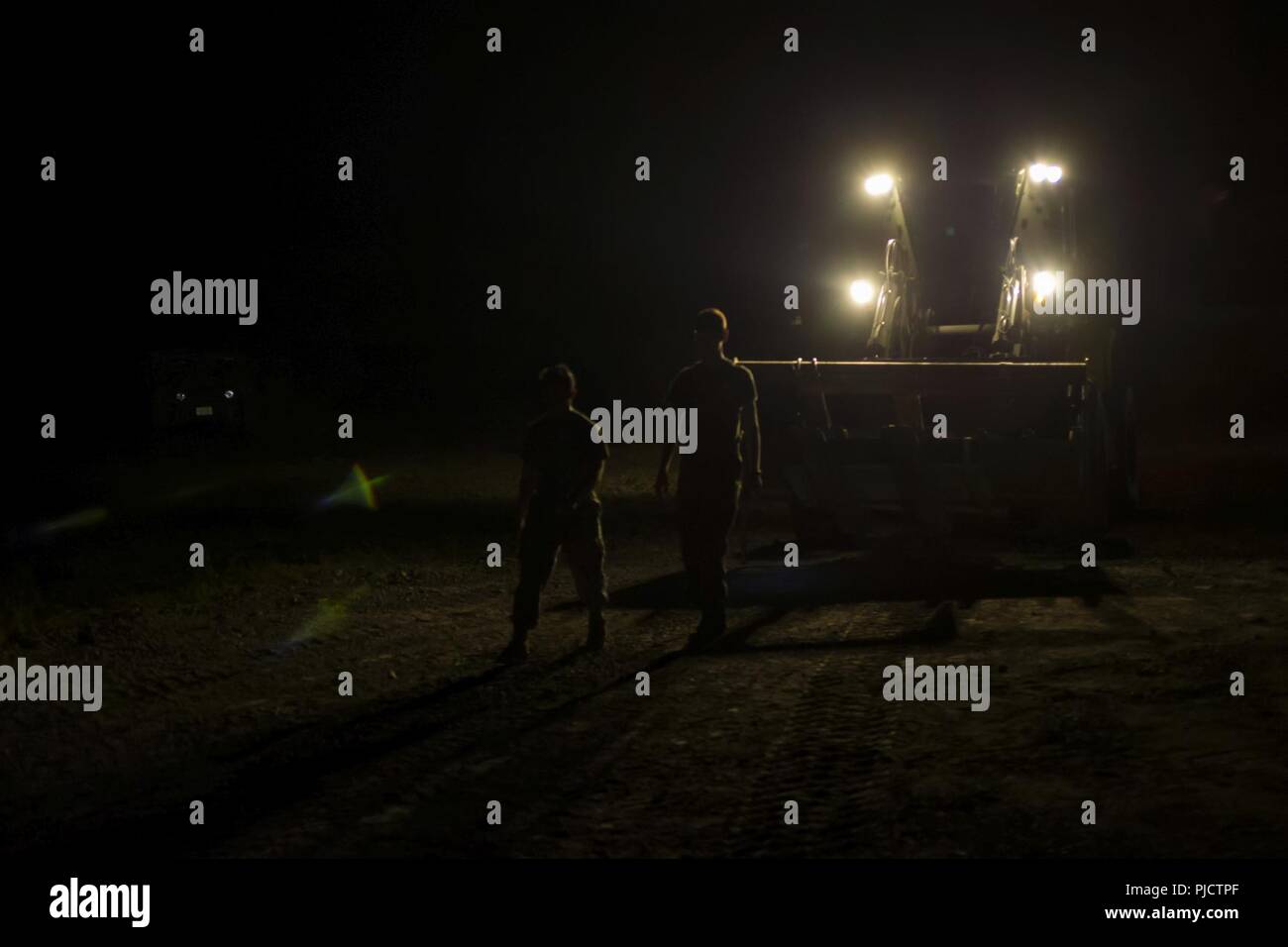 U.S. Marine Corps Lance Cpl. Joseph Capetillo, left, a heavy equipment ...