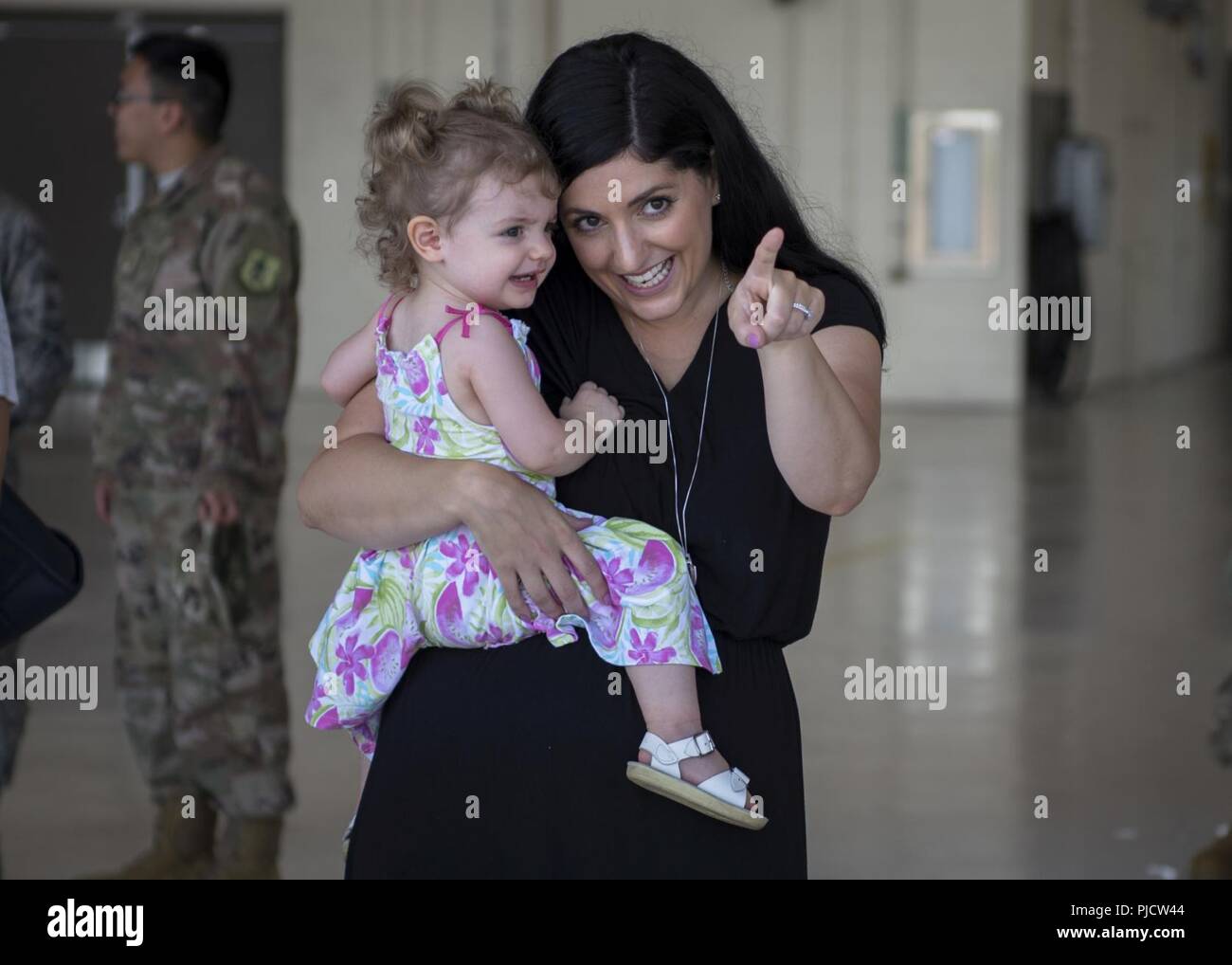 Family and friends await the arrival of their loved ones during the ...