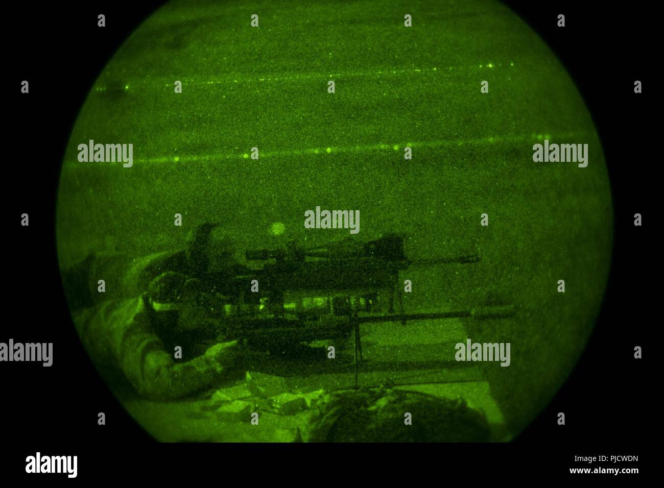 Italian snipers engage targets at a nighttime range exercise on July 9 ...