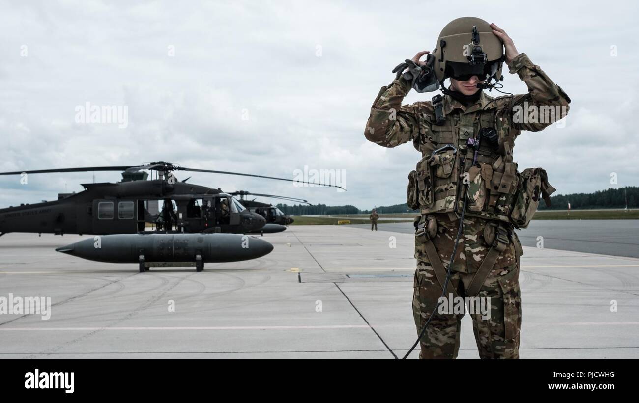 LIELVARDE AIR BASE, LATVIA (July 9, 2018) A UH-60 Blackhawk crewman with Task Force Comanche ...