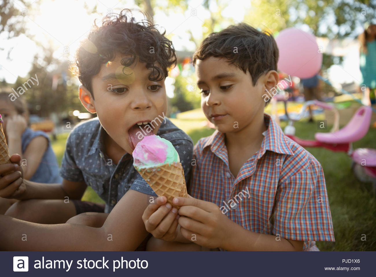 Kids Sharing Ice Cream
