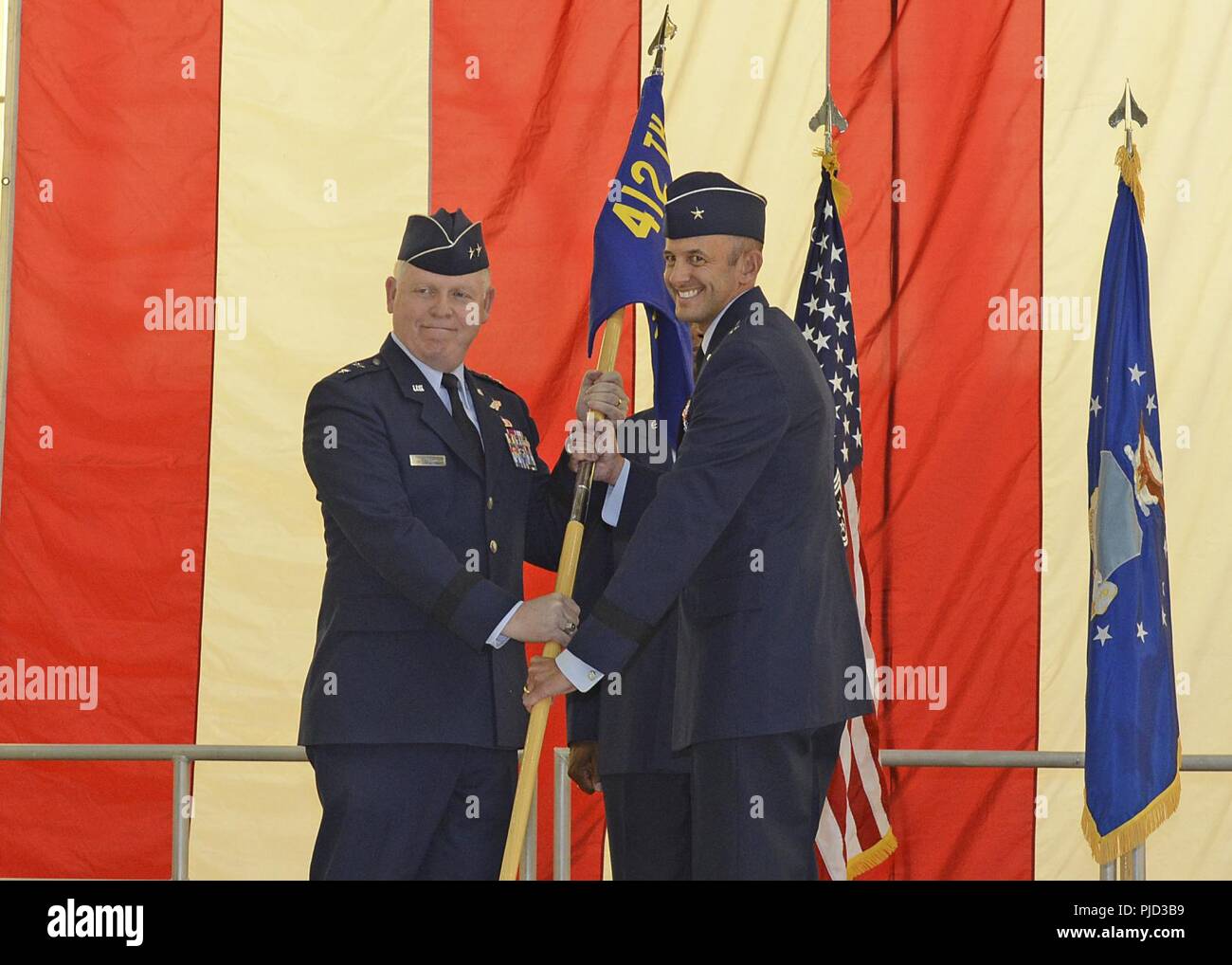 Maj. Gen. David Harris, Air Force Test Center commander (left), passes ...