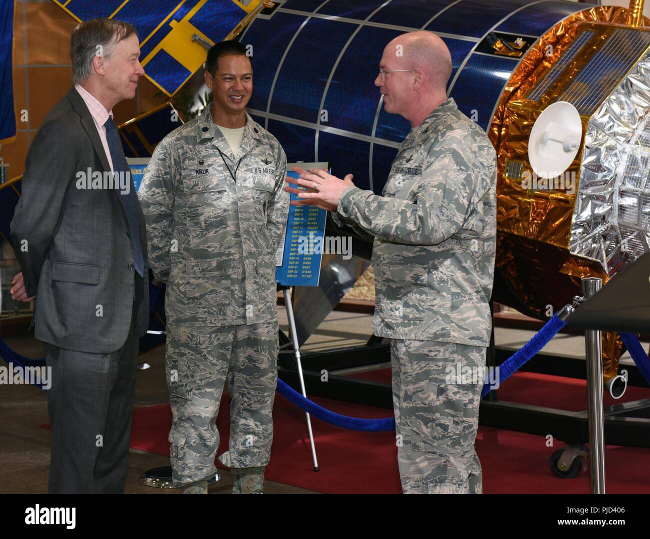 Gov. John Hickenlooper of Colorado, far left, receives a briefing from ...