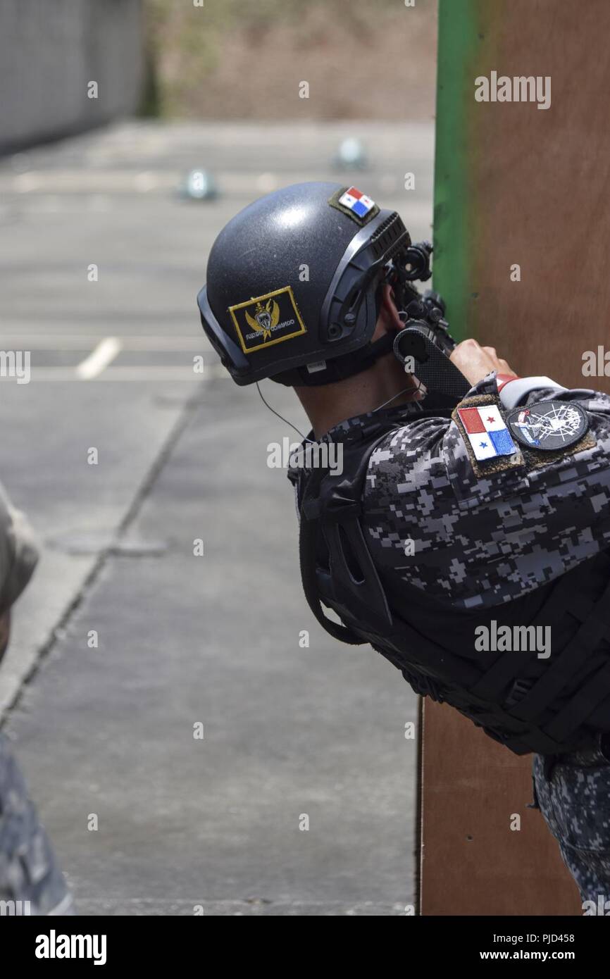 A Panamanian comando shoots targets as part of Fuerzas Comando, July 18 ...
