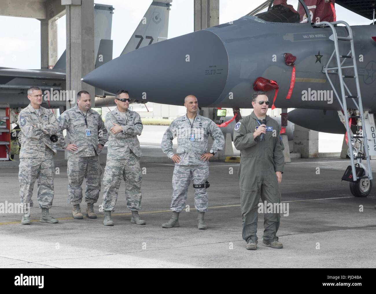 Lt. Col. Matthew Minkley, 18th Operations Group deputy commander, gives ...