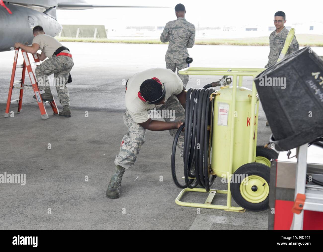 Members of the 67th Aircraft Maintenance Unit start preparing an F-15 ...