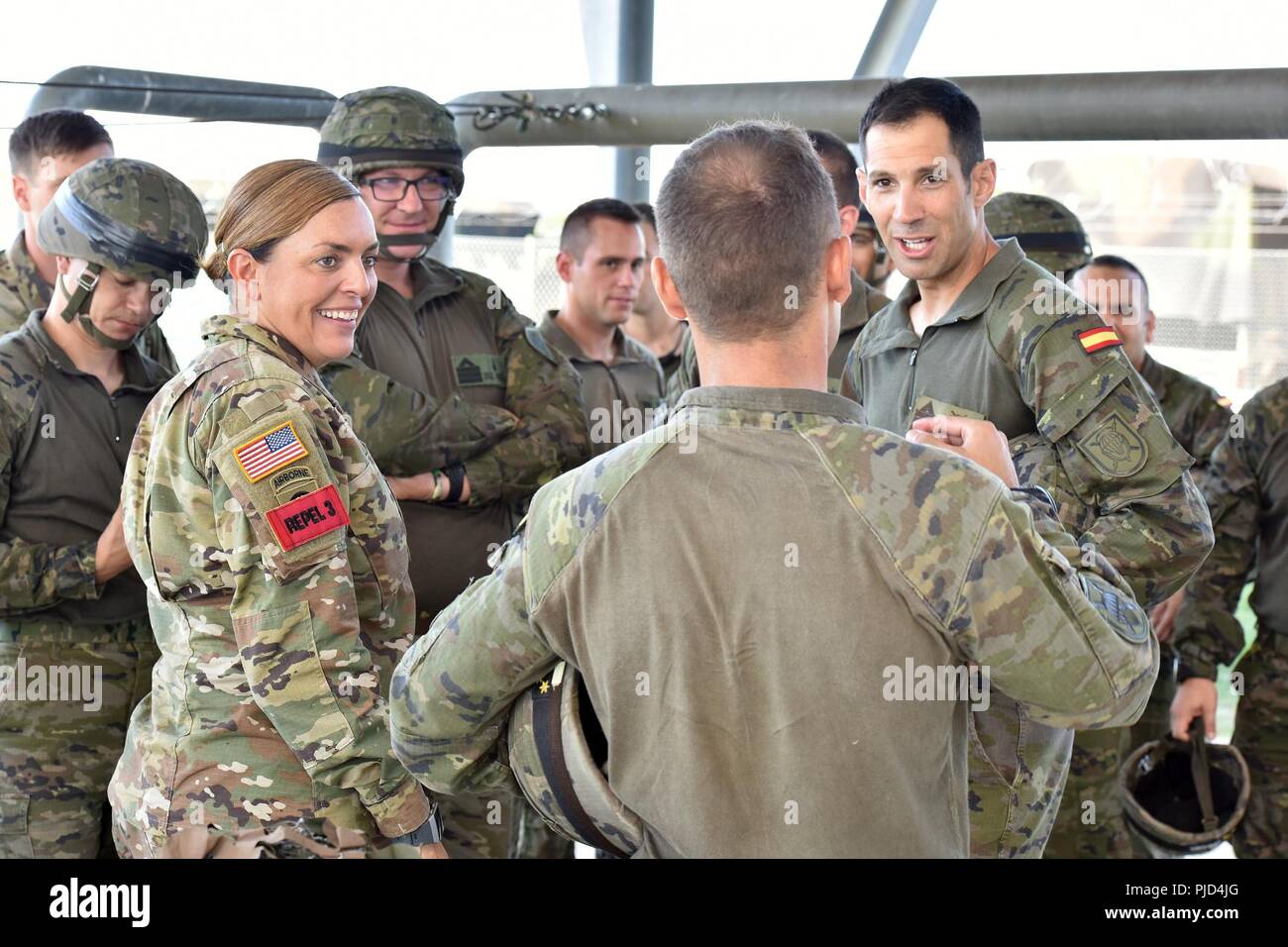 A U.S. Army Paratrooper assigned to 173rd Airborne Brigade, and Spanish ...