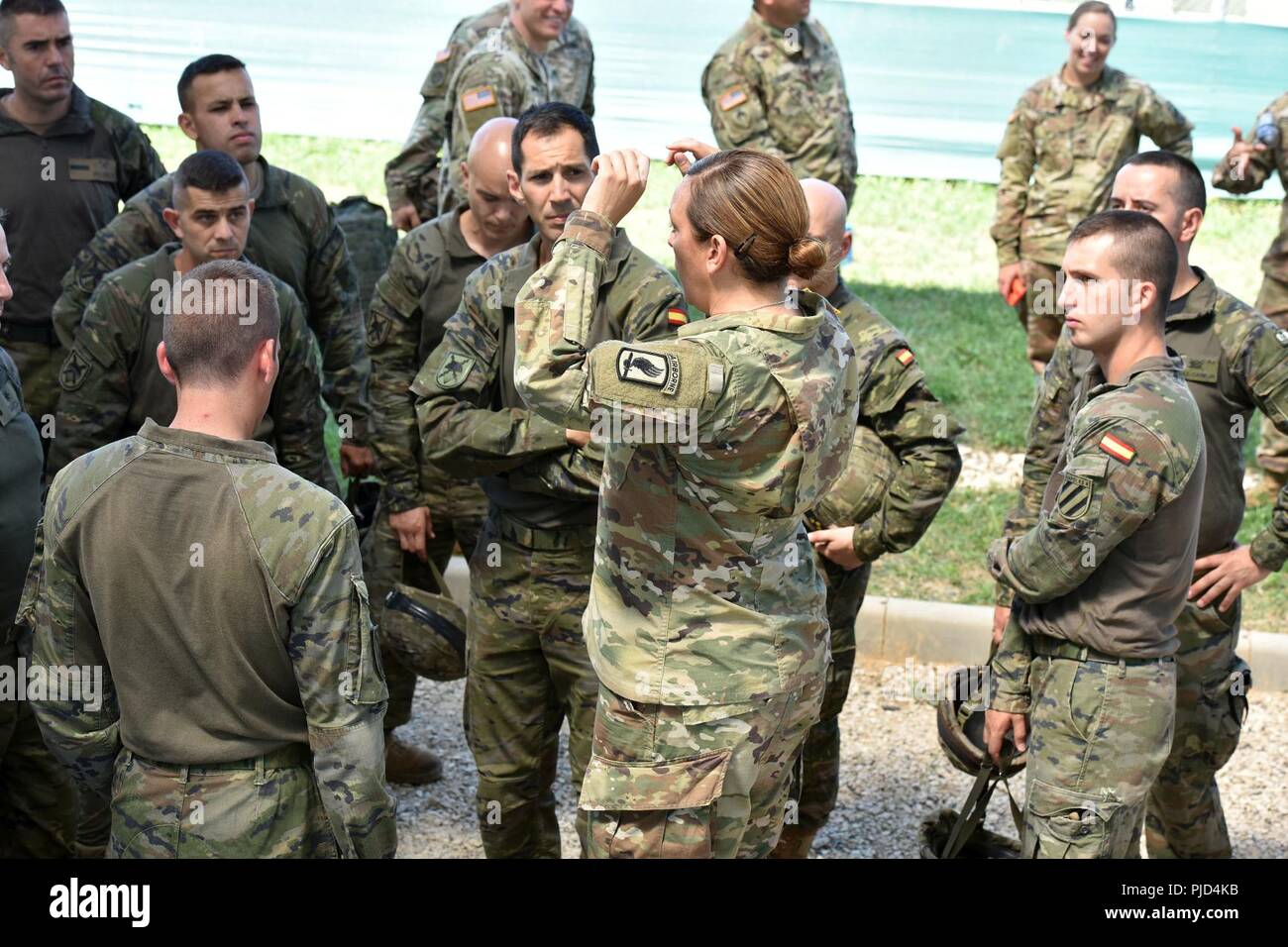 A U.S. Army Paratrooper assigned to 173rd Airborne Brigade, and Spanish ...