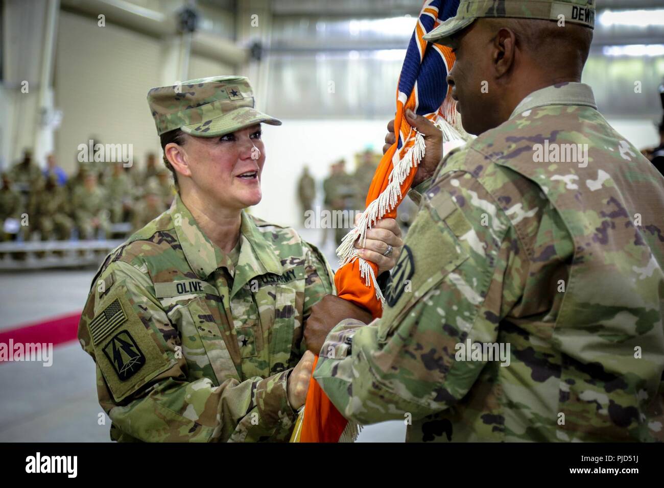 Brig. Gen. Nikki L. Griffin Olive returns the unit flag to Command Sgt ...