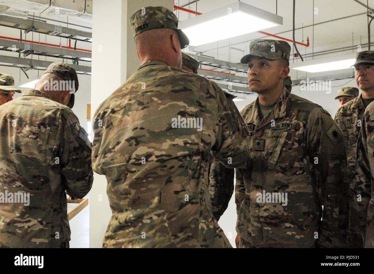 U.S. Army Spc. Mark Ballinger, a cable systems installer-maintainer ...