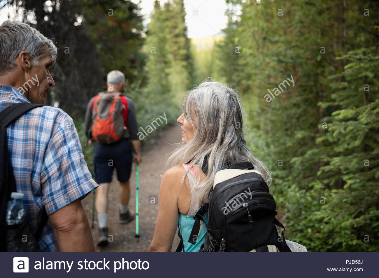 Mature woman hiking on trail hi-res stock photography and images - Alamy