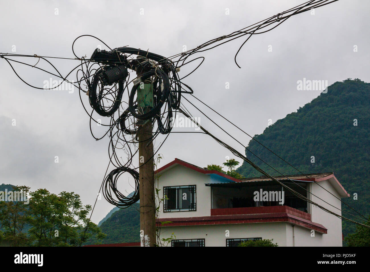 Dangerous tangle of entangled power and low-current wires on Stock ...
