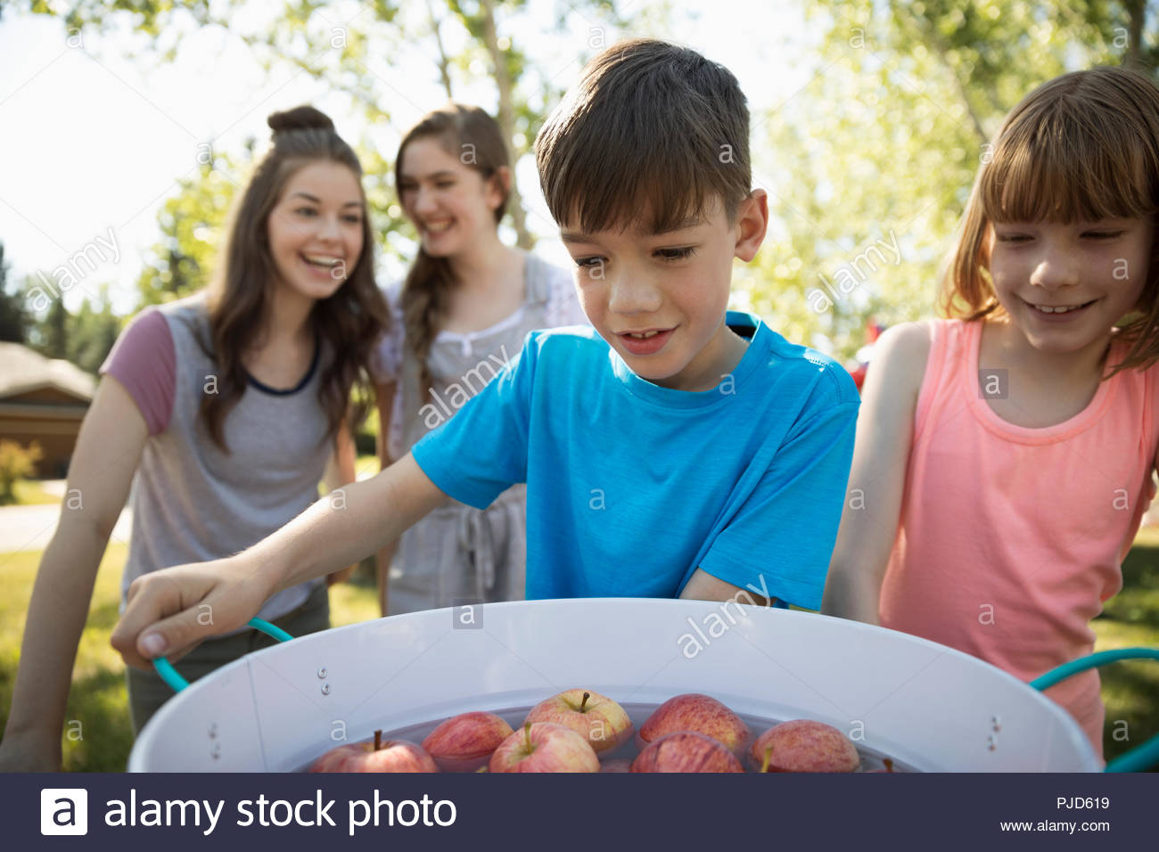 Girl bobbing for apple hi-res stock photography and images - Alamy