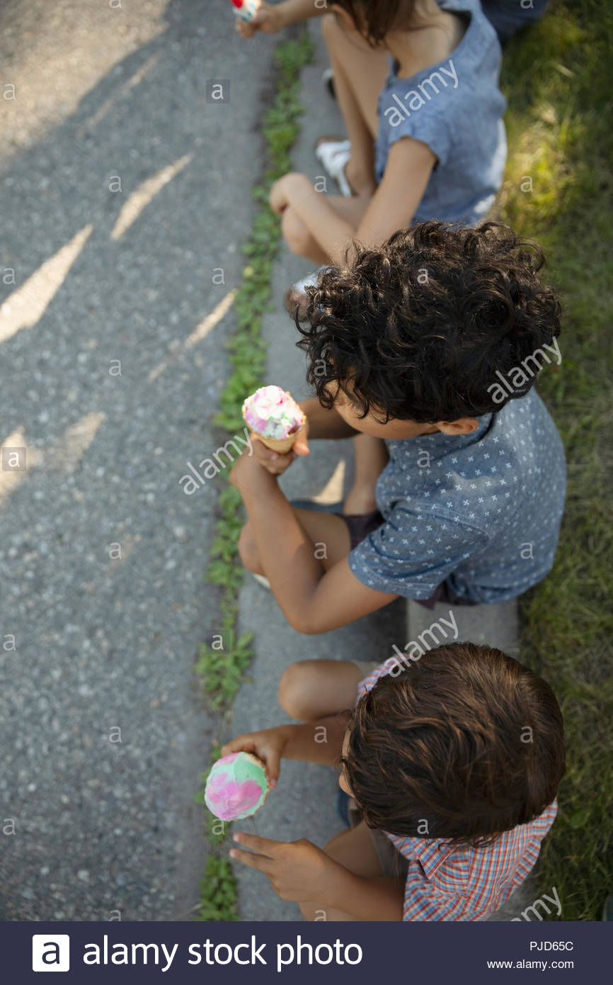 Kids sitting on curb on hi-res stock photography and images - Alamy
